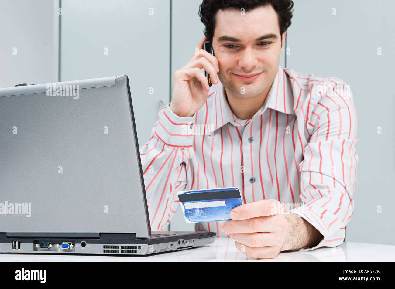 Man telephone banking Stock Photo - Alamy