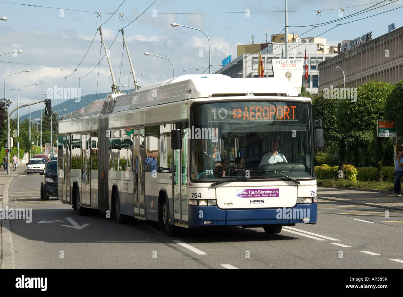 electric trolley bus on a street in Geneva Switzerland Stock Photo - Alamy