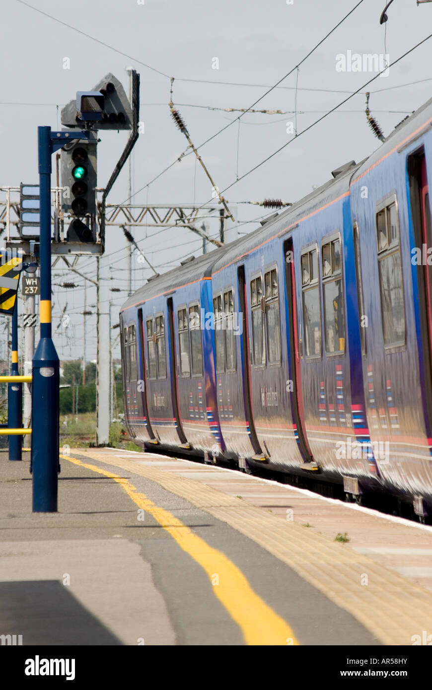 first capital connect train passing through a station with railway ...