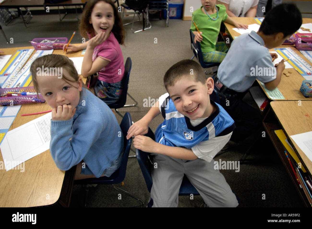 7 and 8 year old kids learning together in 2nd grade classroom Stock ...