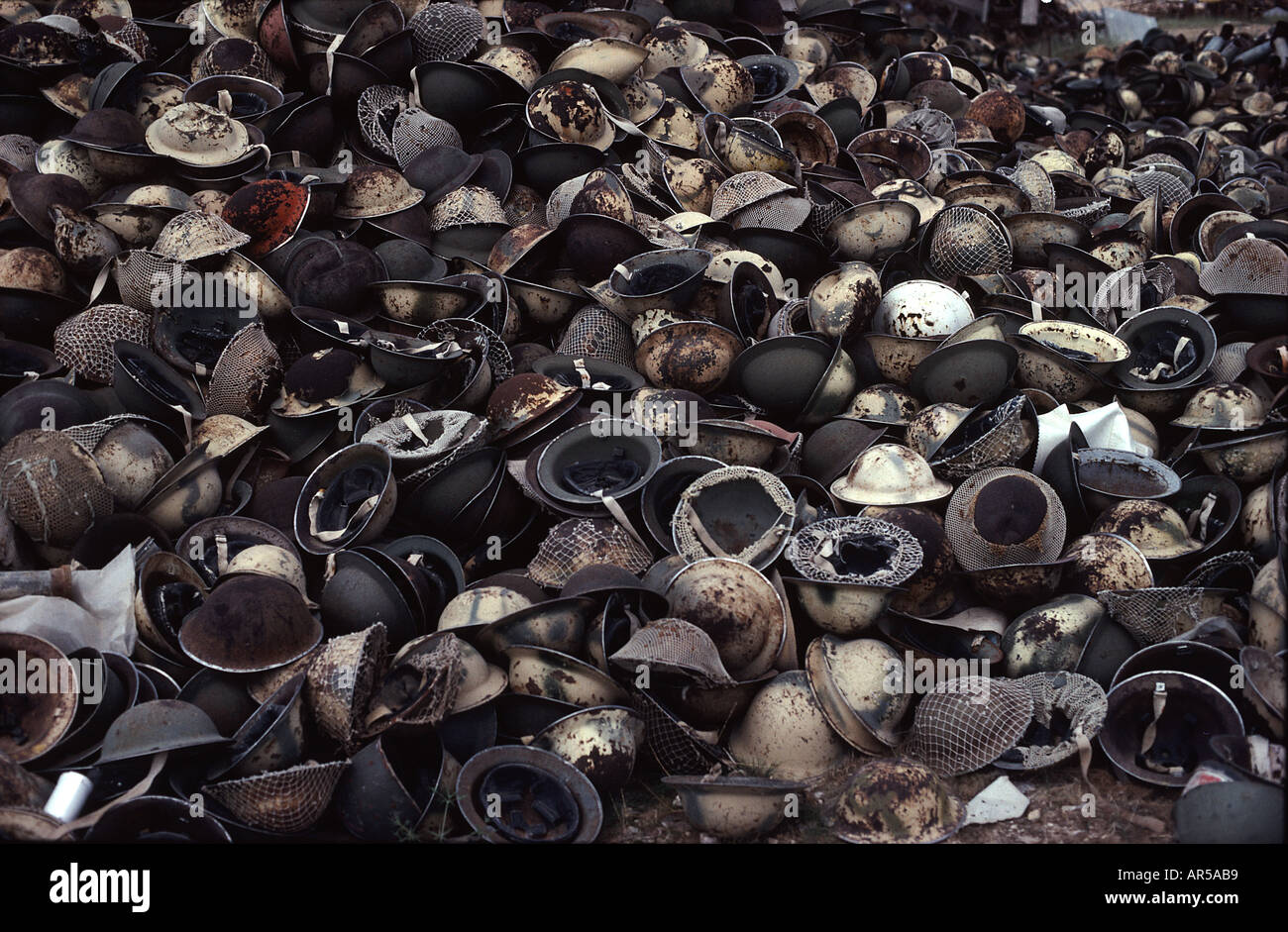 Pile of discarded army helmets in Jordan Stock Photo - Alamy