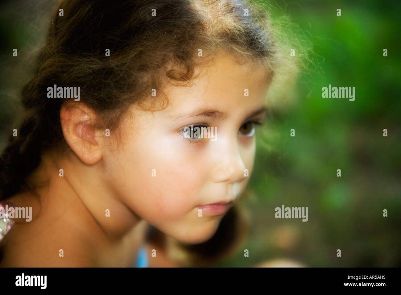 Pretty child with thoughtful expression Stock Photo - Alamy