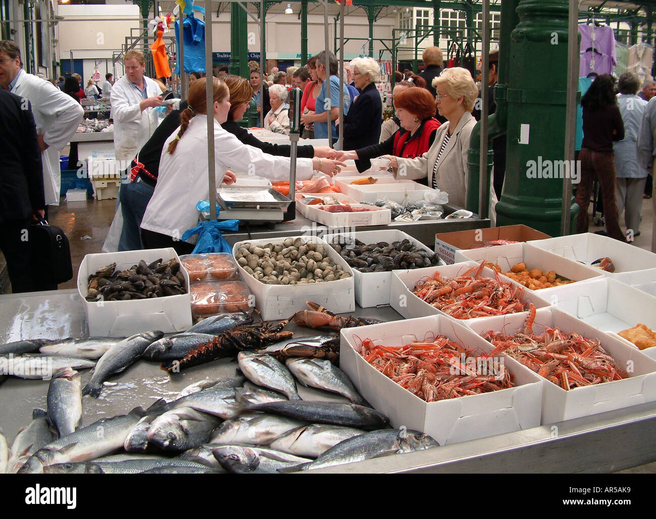 Shopping for fish at St Georges Market Stock Photo - Alamy