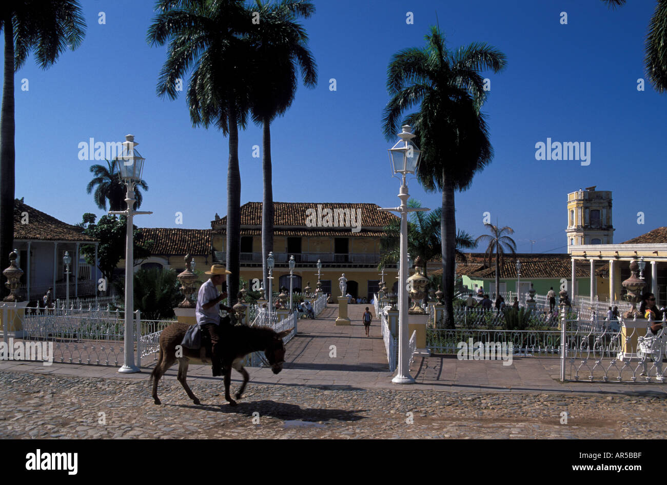 Older Man riding on donkey Plaza Mayor Trinidad UNESCO World Heritage ...