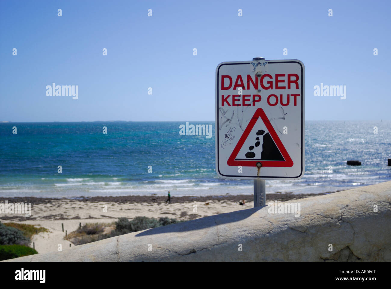 Sign warning of danger from falling rocks Stock Photo - Alamy
