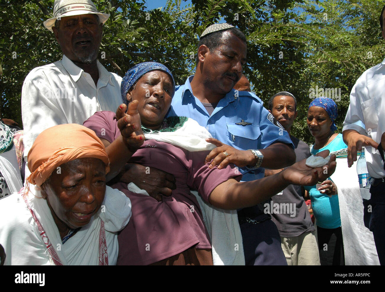Members of the Beta Israel community mourn during funeral of an Israeli ...