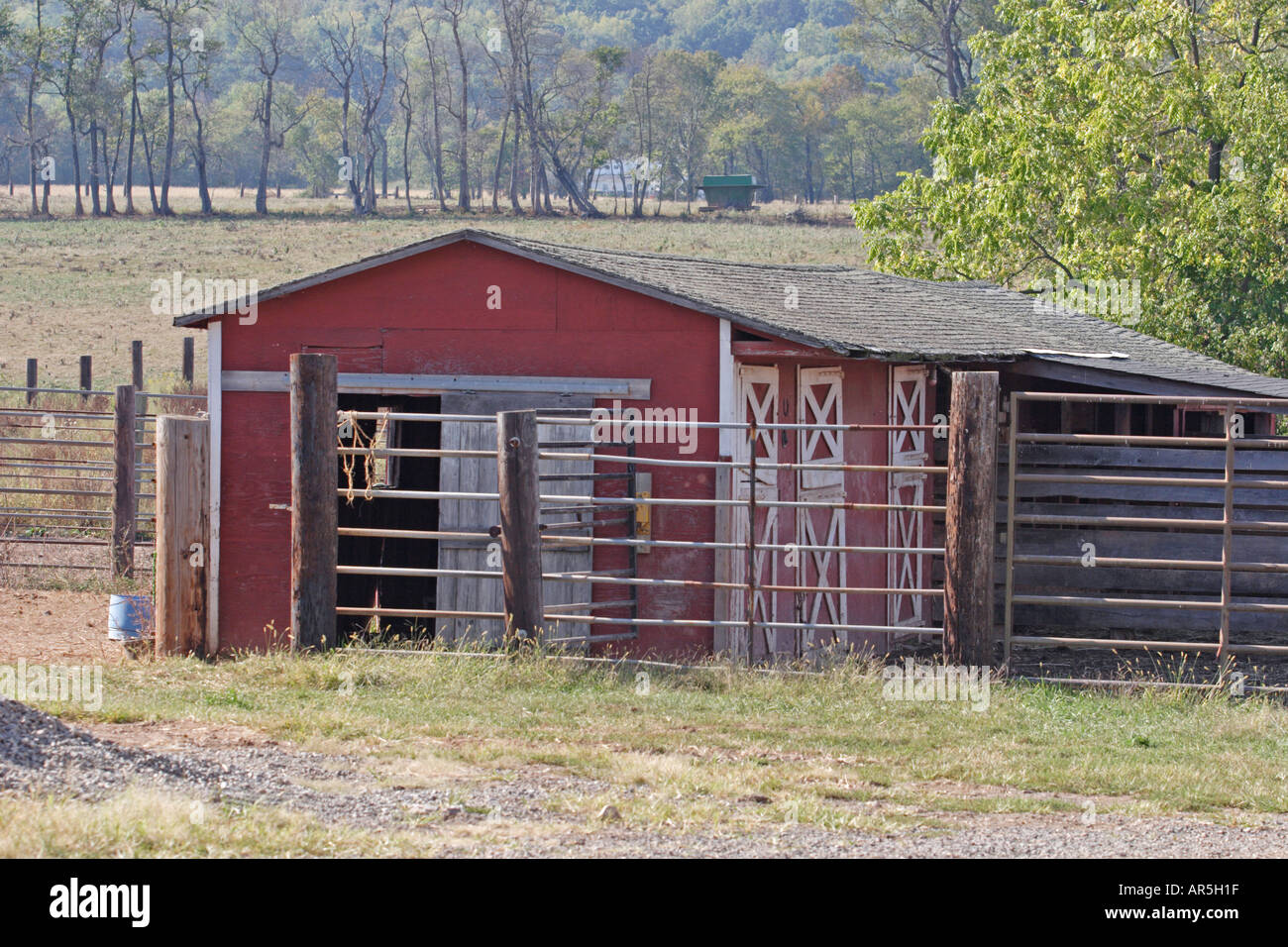 Farm outbuilding and fence Stock Photo - Alamy