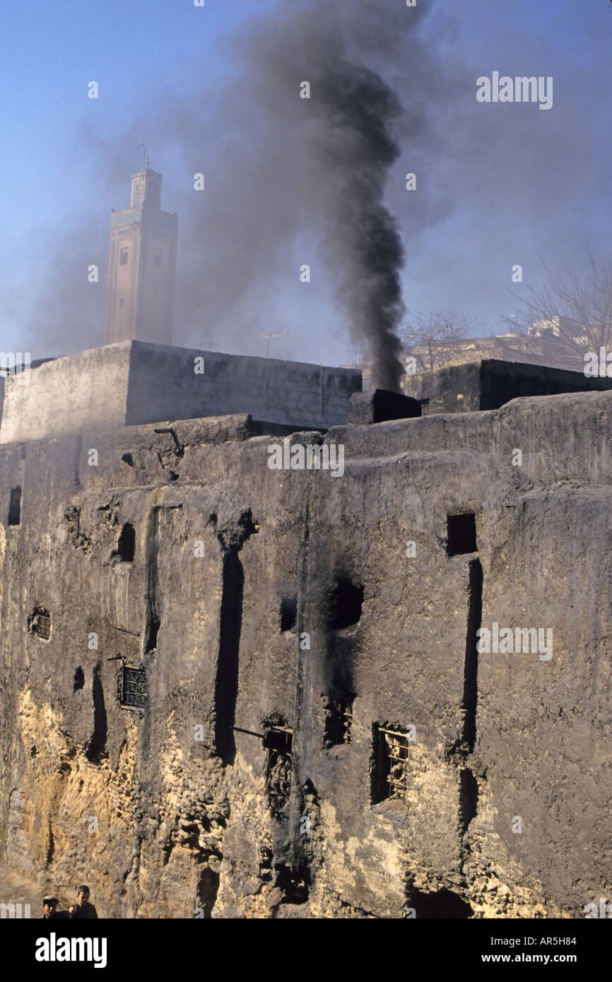 Smoke roars out of building near Mosque in Morocco North Africa Stock ...
