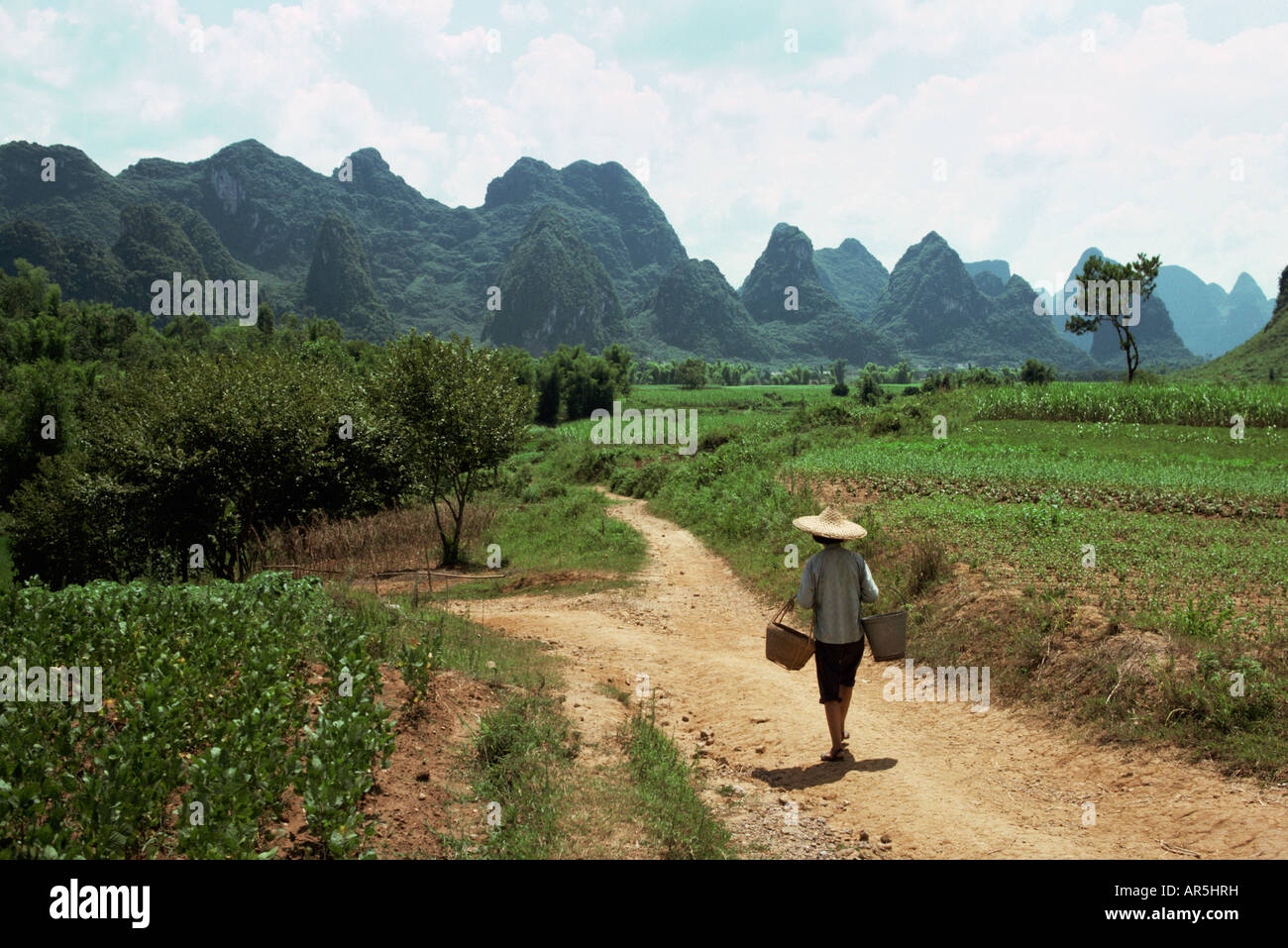 Farm worker in china Stock Photo - Alamy