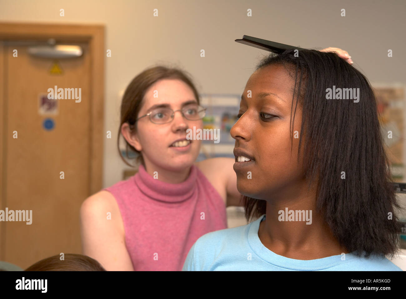 Medical student measuring height at University Stock Photo - Alamy