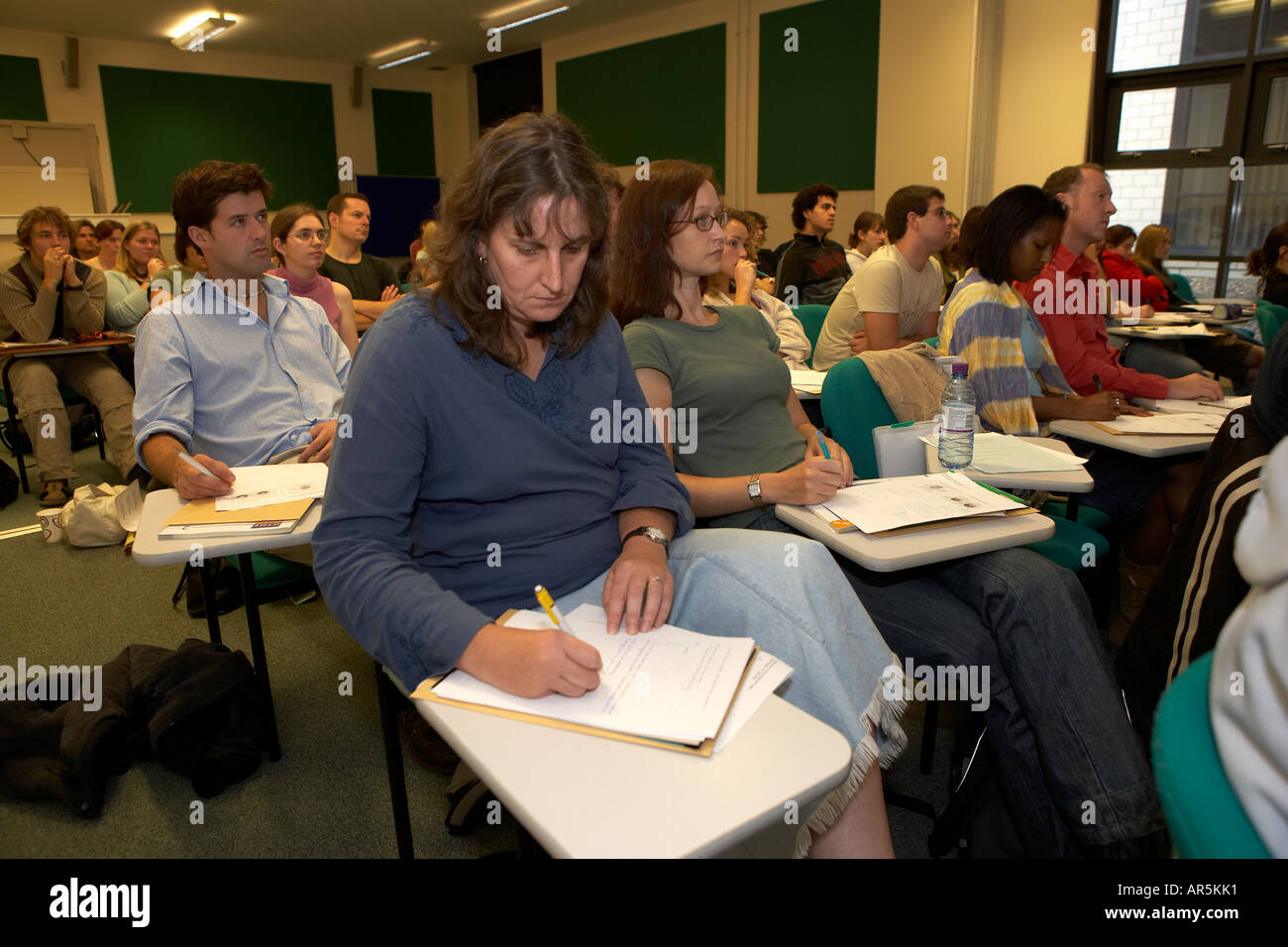 University students listening to a lecture Stock Photo - Alamy