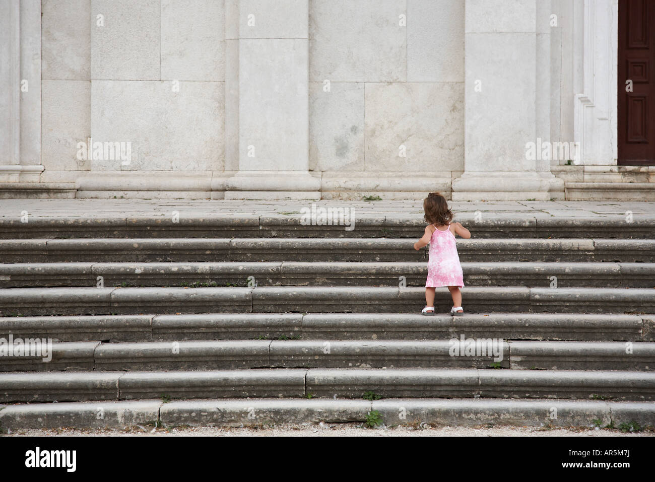 Girl on steps Stock Photo - Alamy