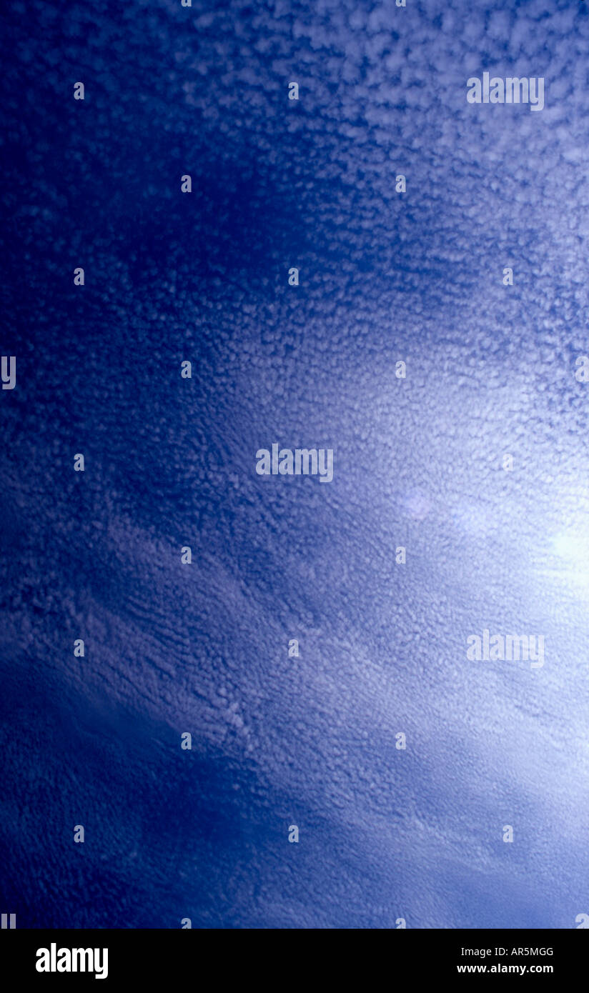 high cirrus clouds showing patterning and refracted colour Stock Photo ...