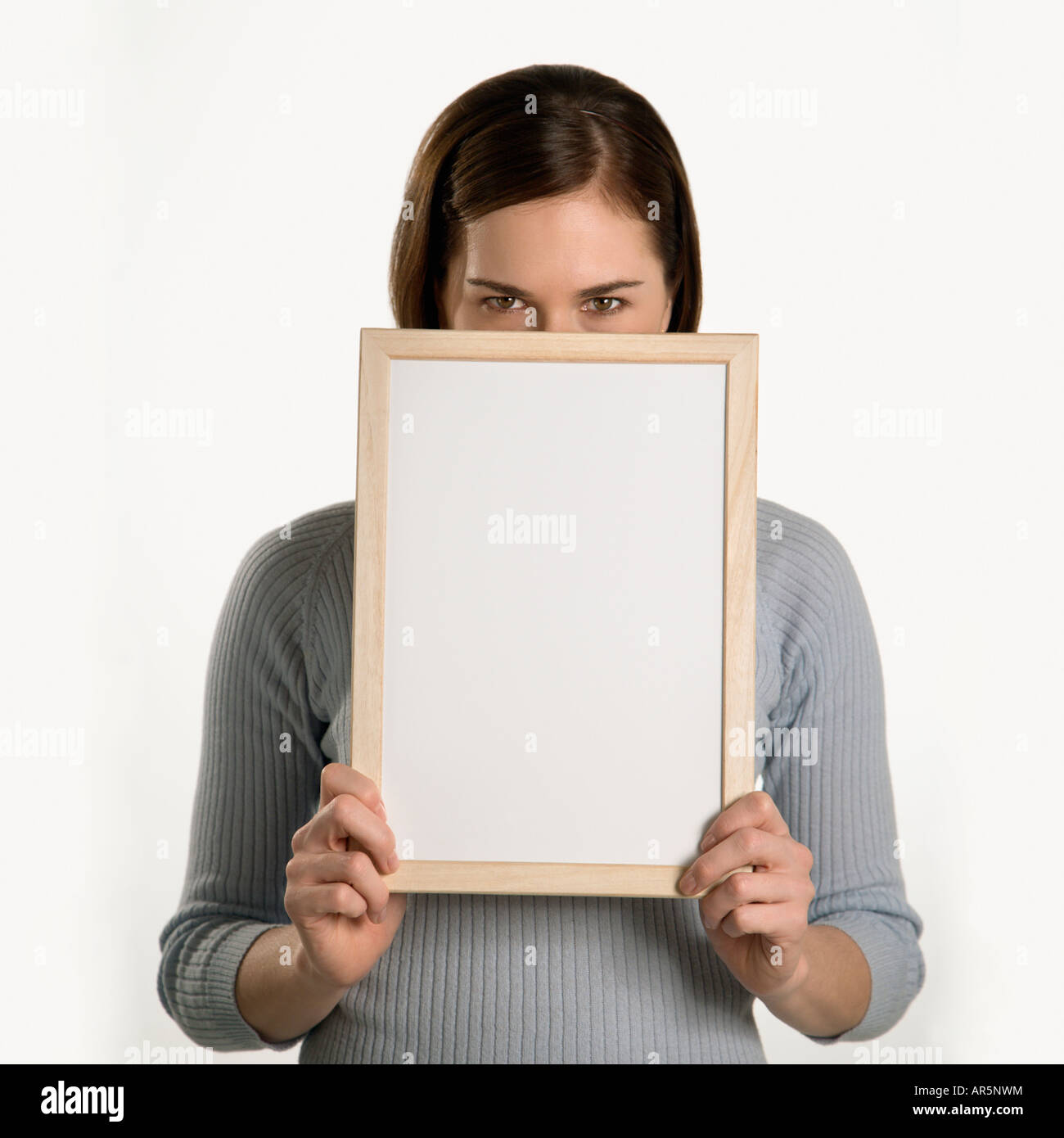 Caucasian mid adult professional business woman peeking over top of ...