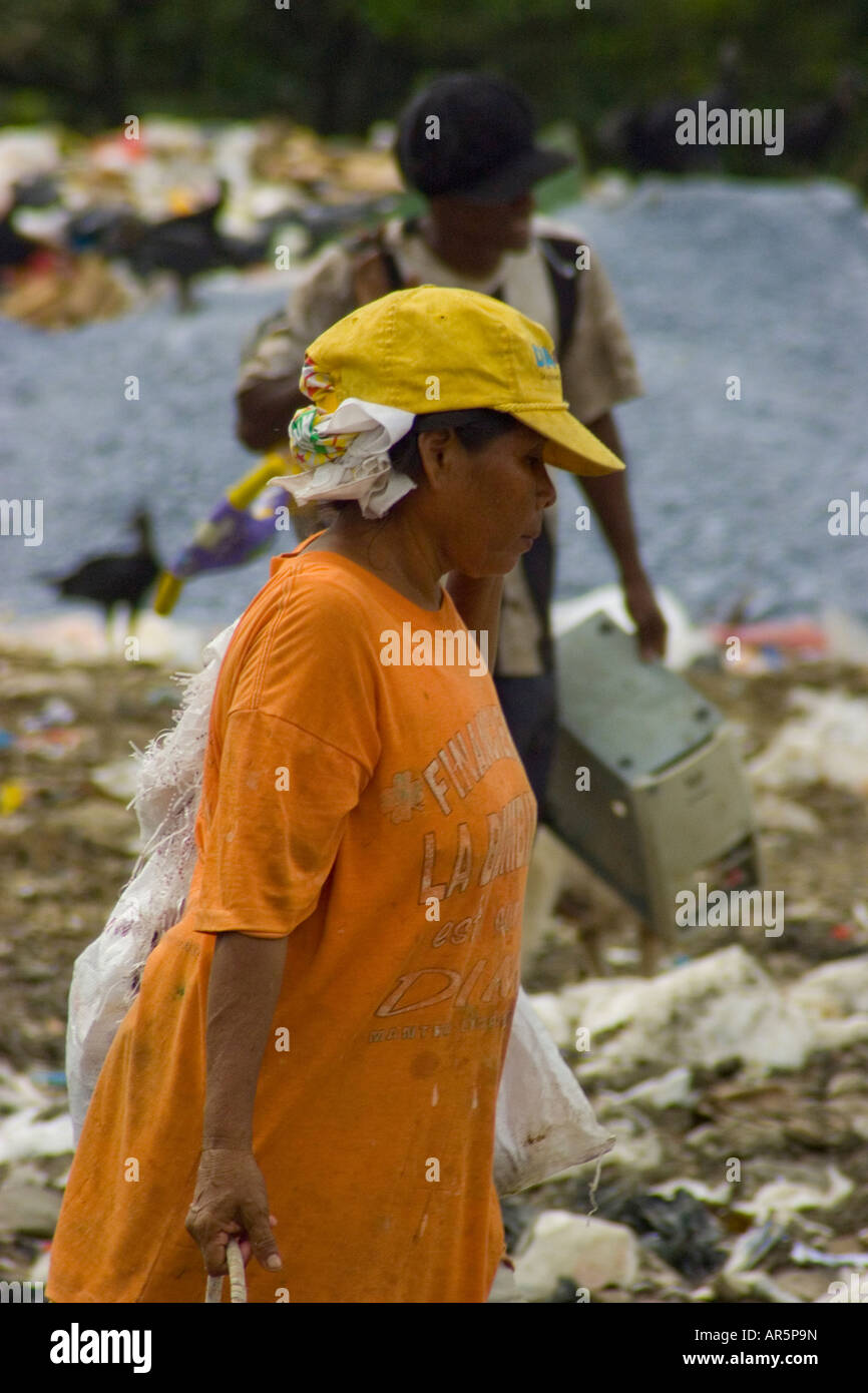 An old lady loading garbage Stock Photo - Alamy