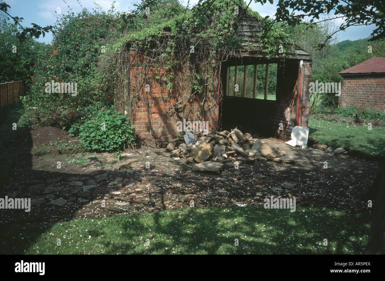 Derelict garage in garden before renovation Stock Photo - Alamy