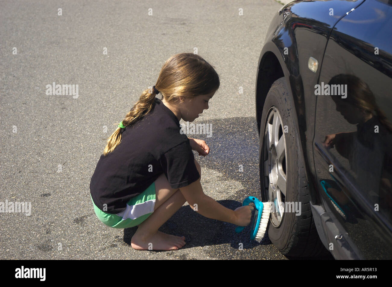 girl washing car tire Stock Photo - Alamy