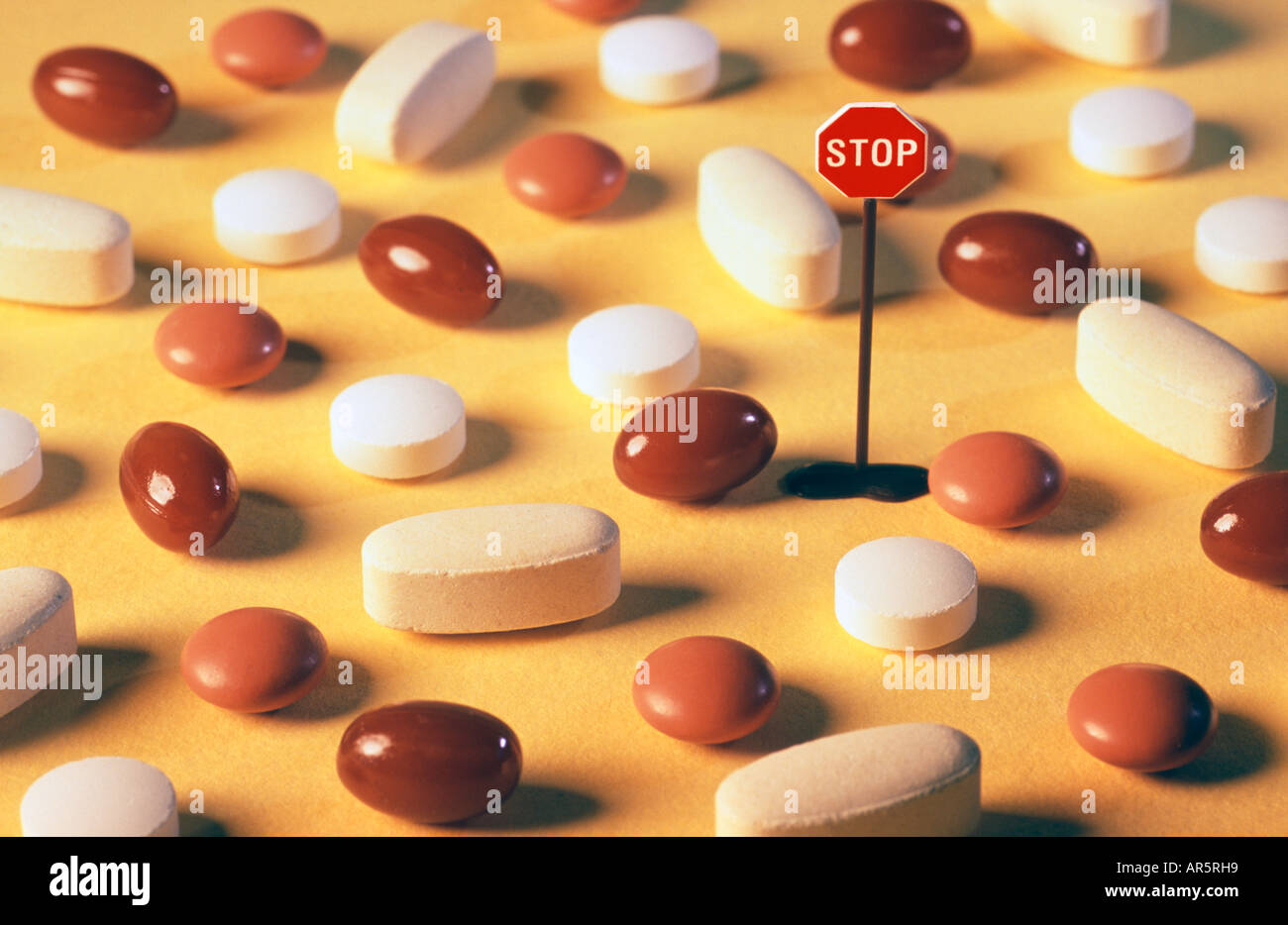 Pills vitamins medication and Stop sign Stock Photo - Alamy