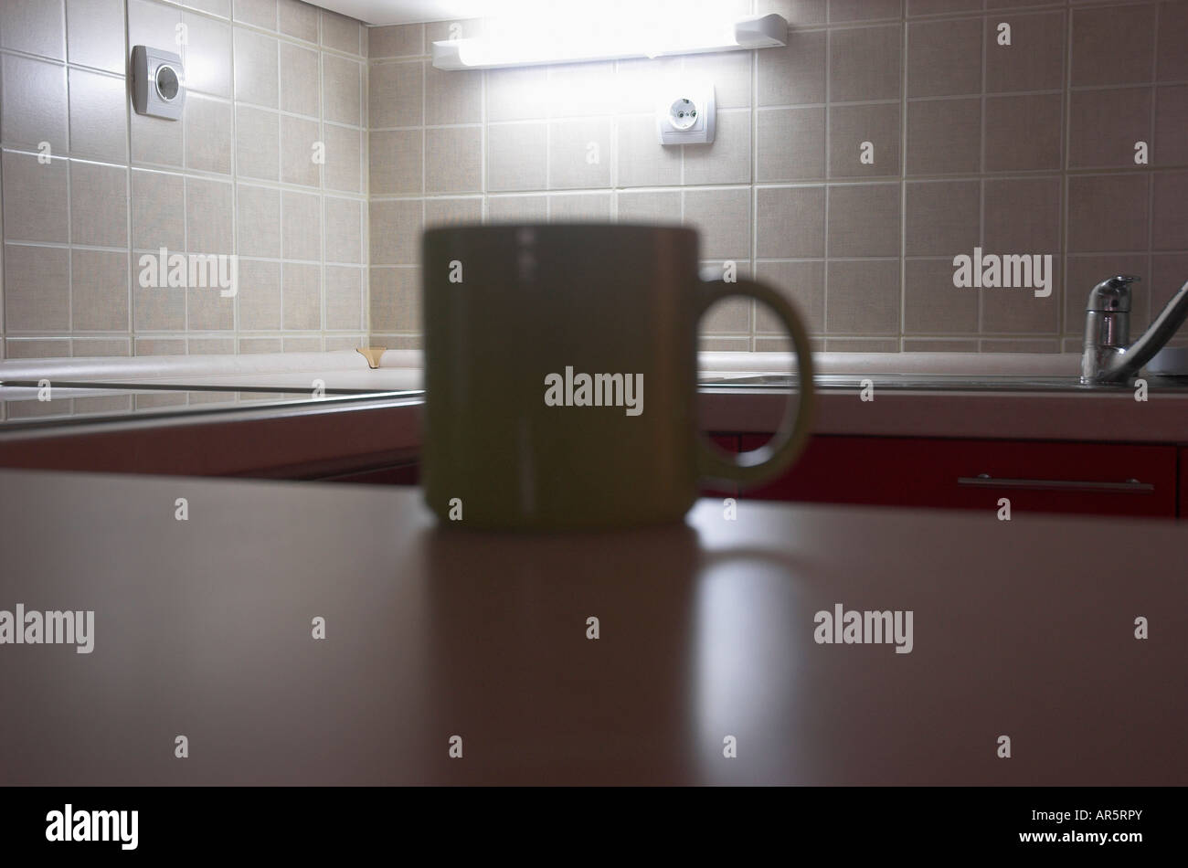 Cup of coffee on kitchen counter Stock Photo - Alamy
