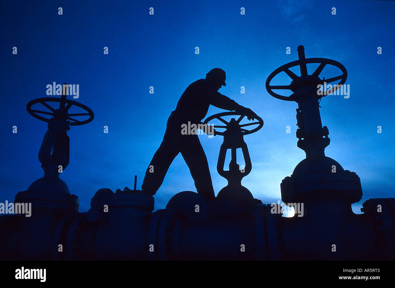 Oil worker turning valve hi-res stock photography and images - Alamy