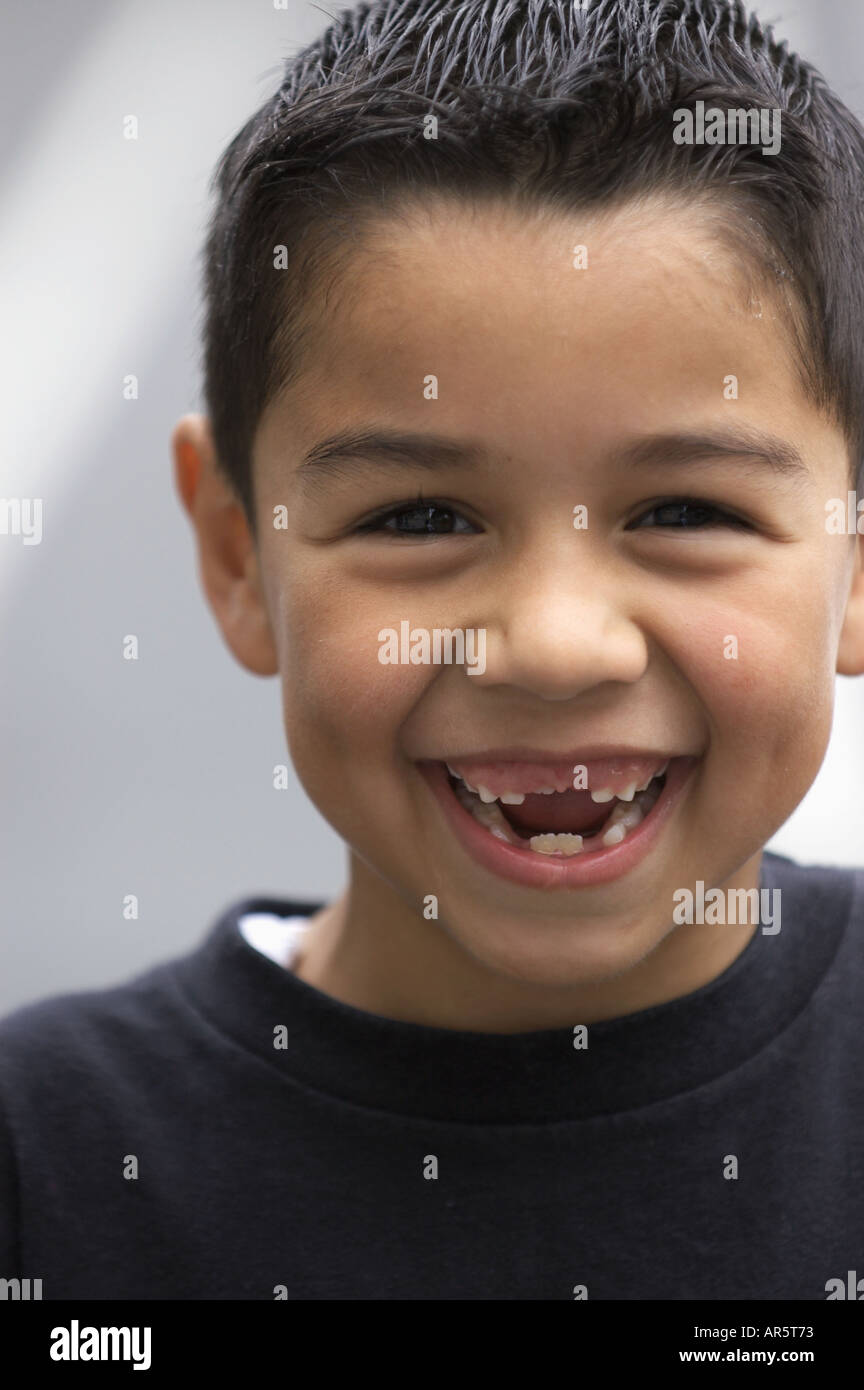 smiling Latin boy missing teeth Stock Photo - Alamy