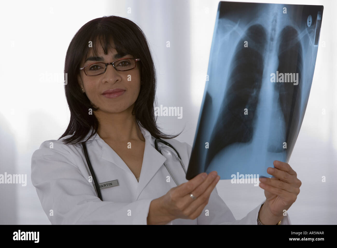 Female doctor holding x-ray Stock Photo - Alamy