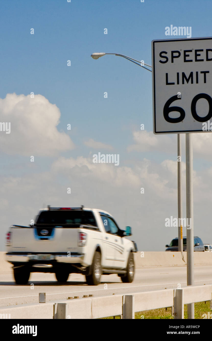 Truck Passing Speed Limit Sign Stock Photo - Alamy