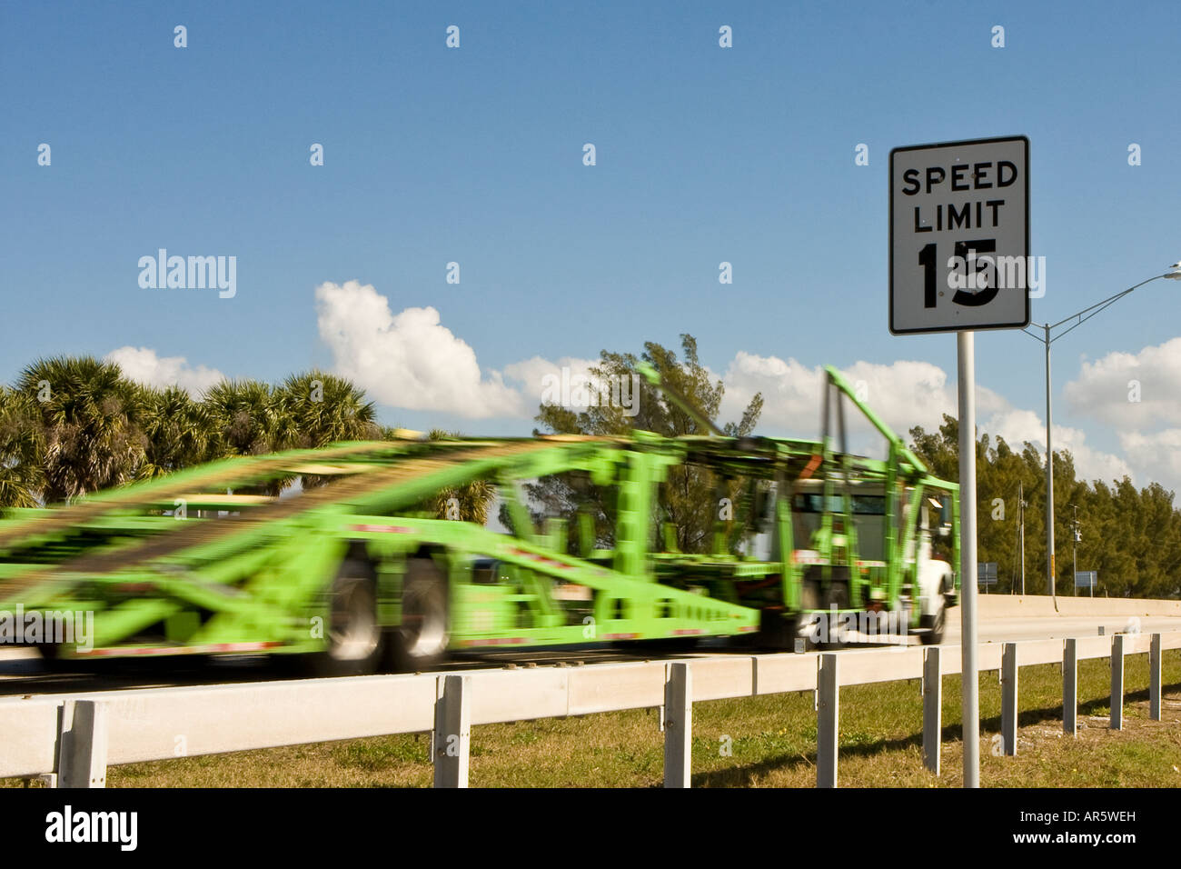 Tractor Trailer Passing Speed Limit Sign Stock Photo - Alamy