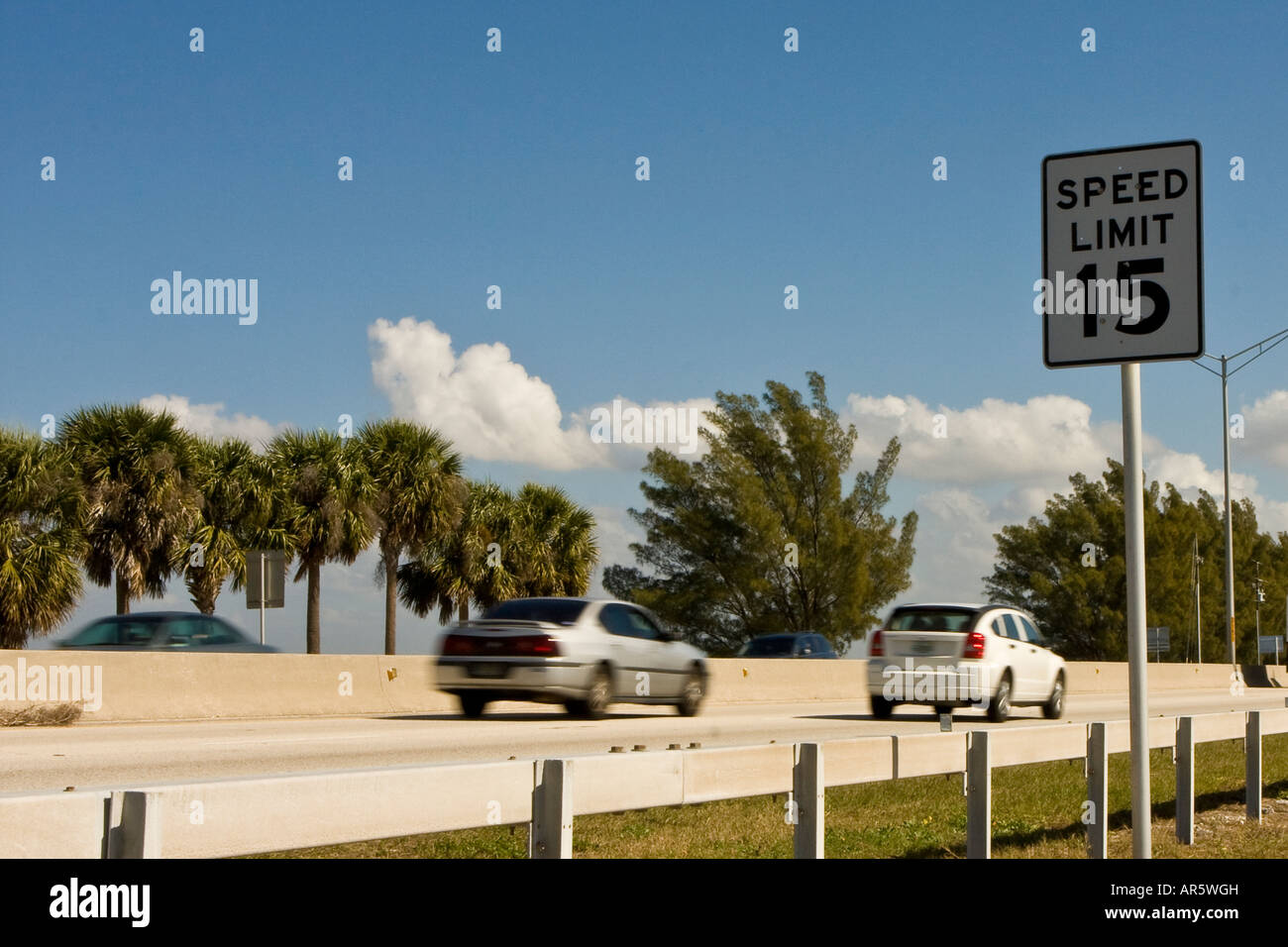 Car Passing Speed Limit Sign Stock Photo - Alamy