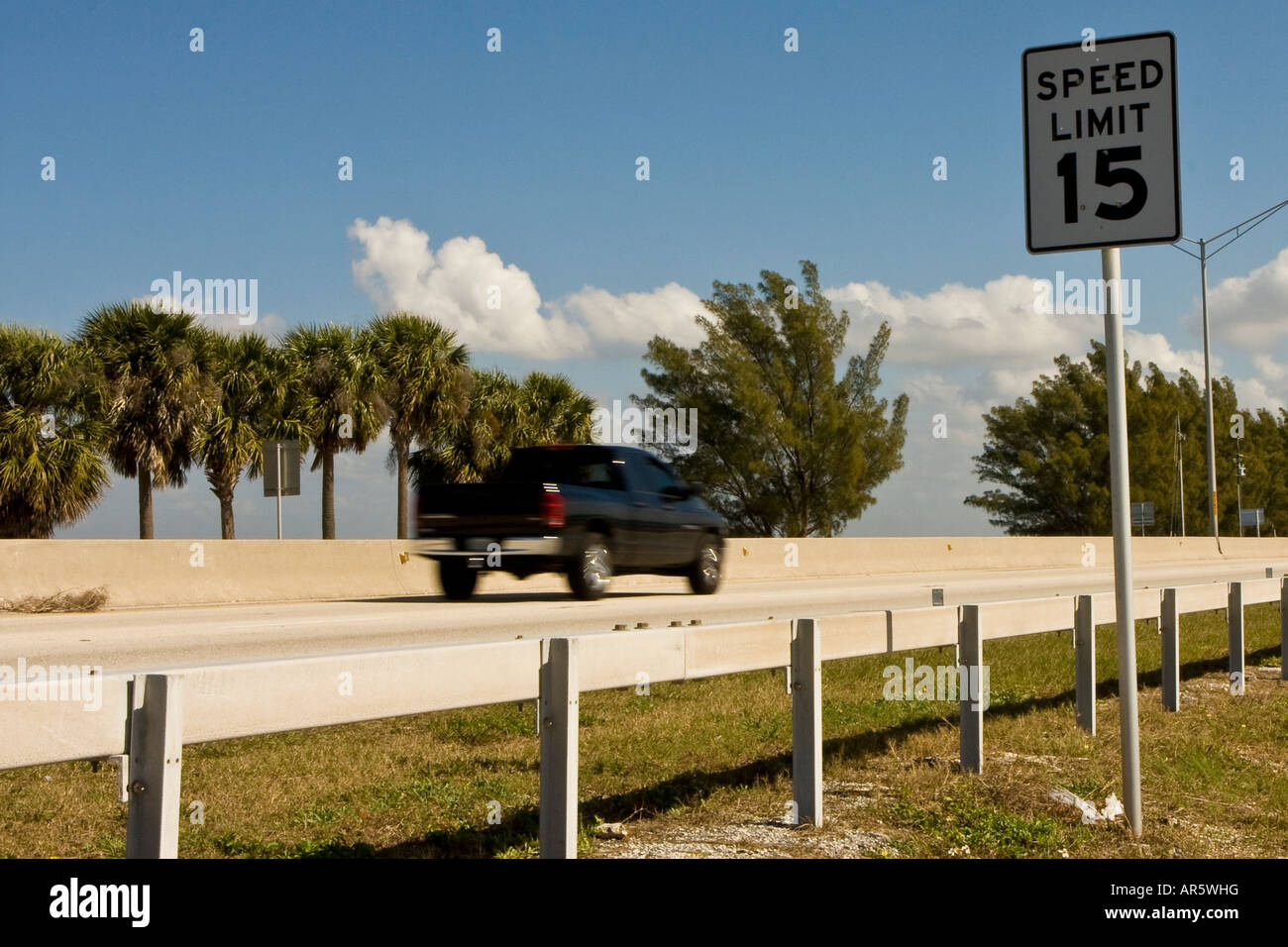 Car Passing Speed Limit Sign Stock Photo - Alamy