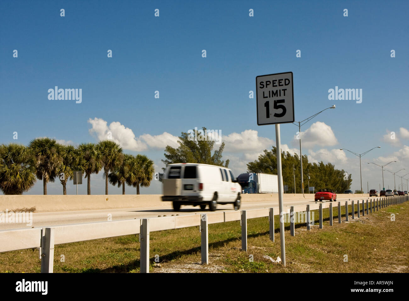 Car Passing Speed Limit Sign Stock Photo - Alamy