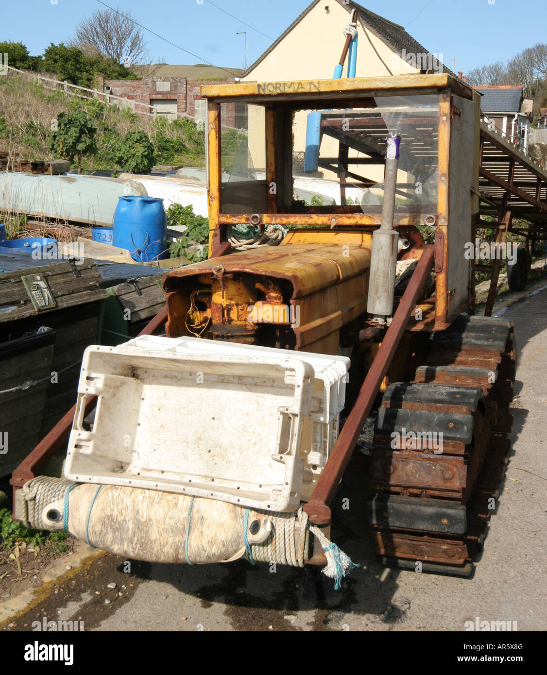 Rusty tractor at Lulworth Cove, Dorset - fisherman use this for ...