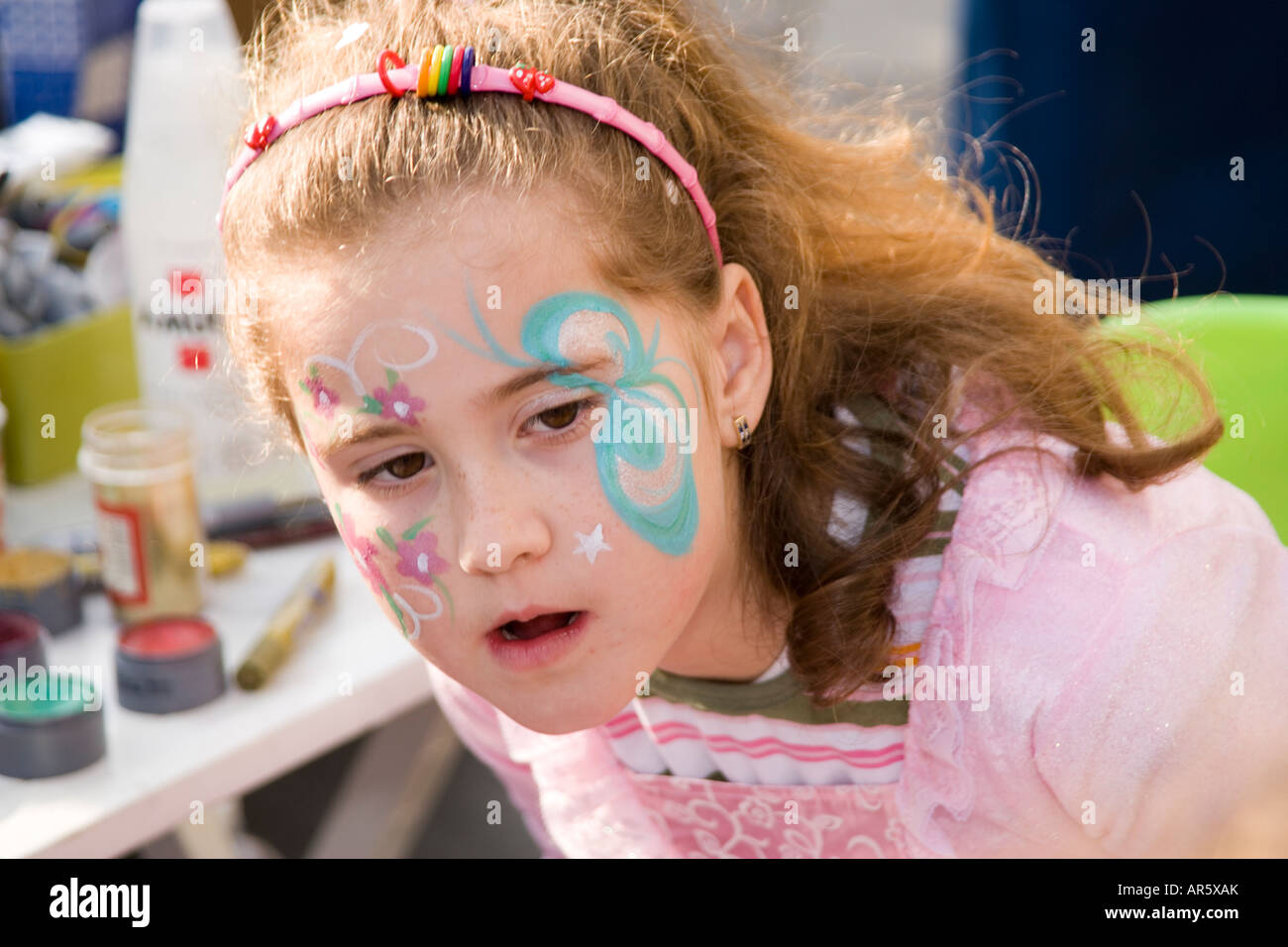 Girl having her face painted at the Carnival in Venice, Italy Stock ...