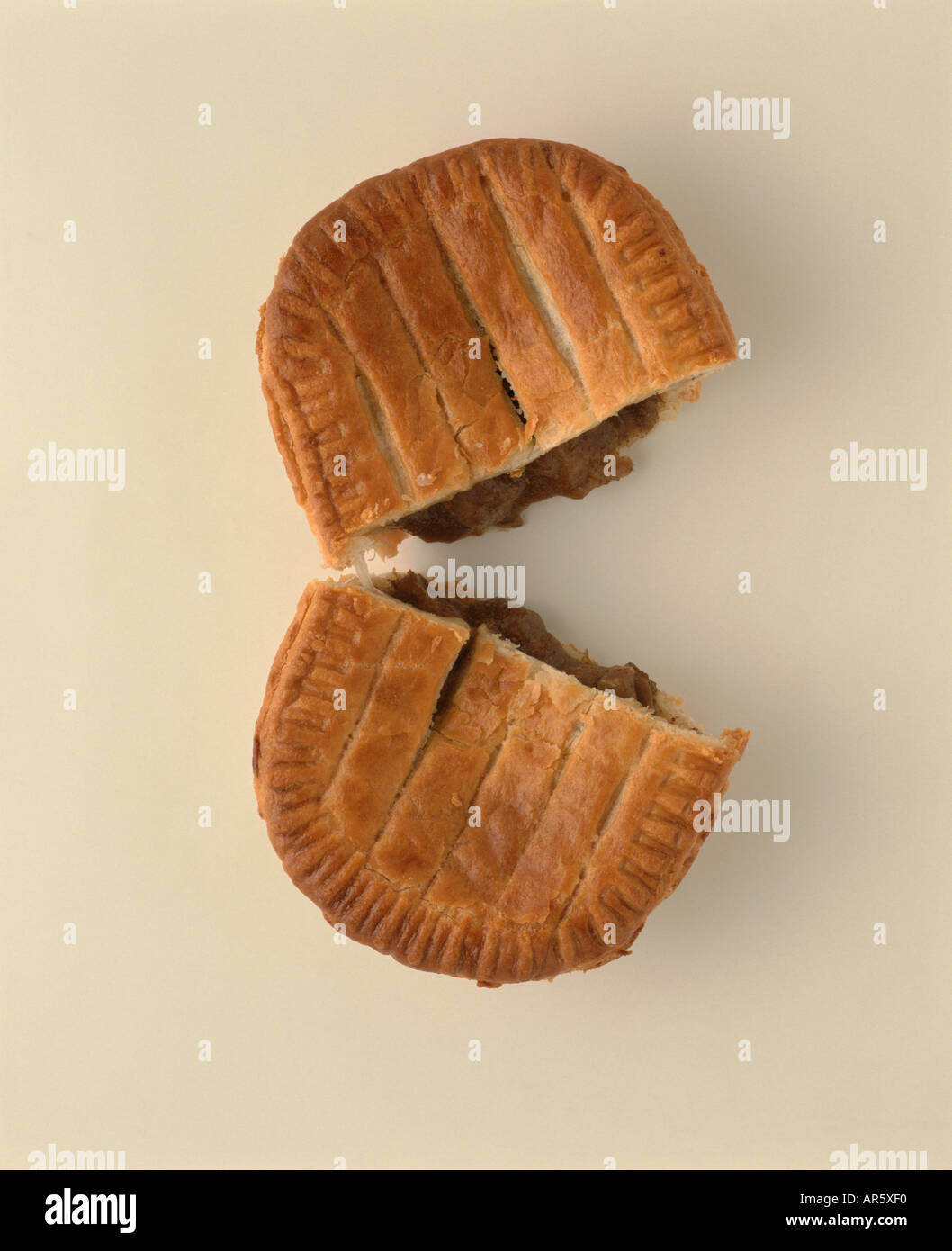 Meat pie cut in half Stock Photo - Alamy