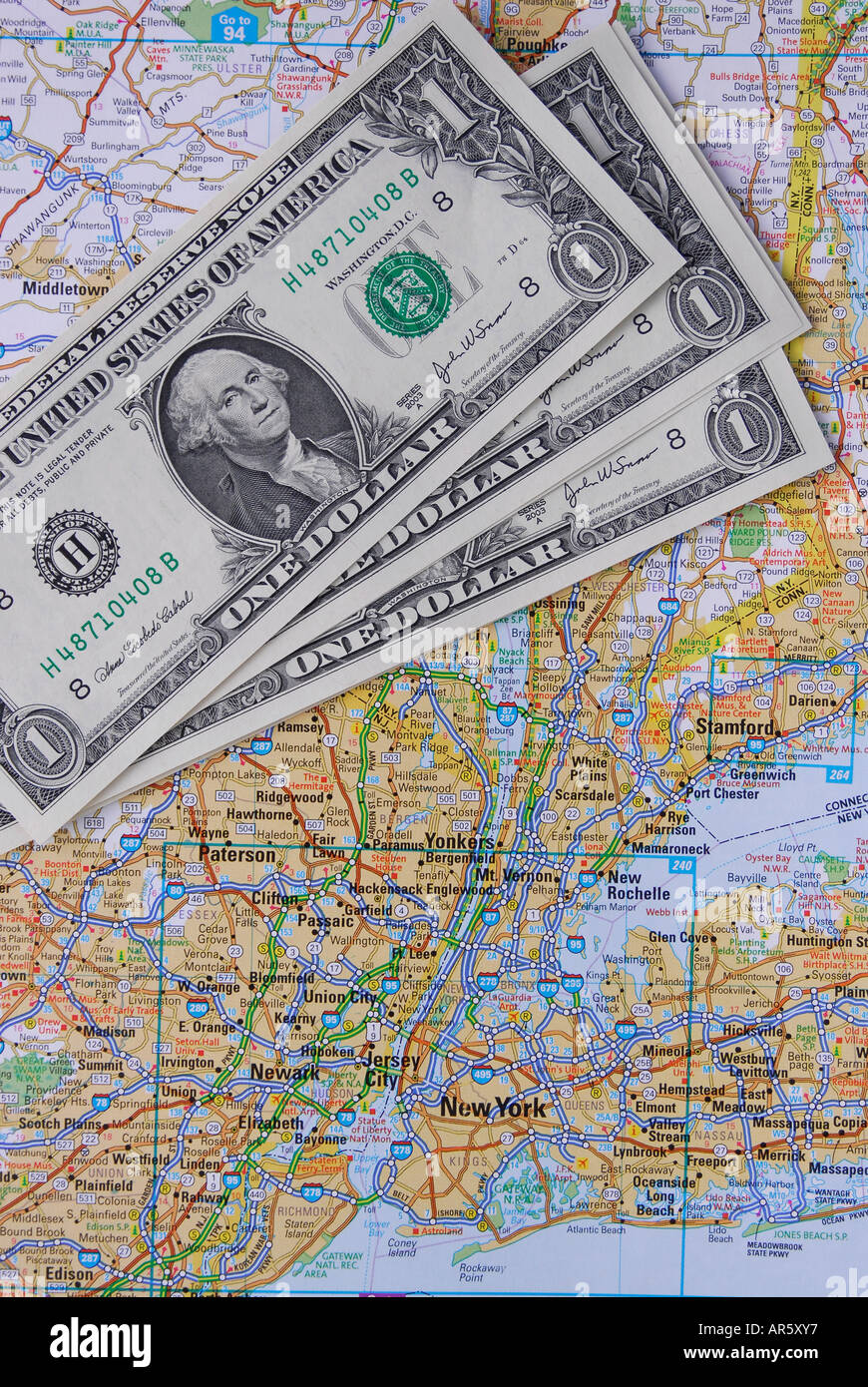 US American dollar bills on a map of New York, USA Stock Photo - Alamy