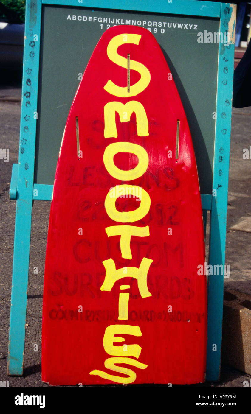 A surfboard sign advertising a smoothie restaurant in Haleweia, Hawaii ...