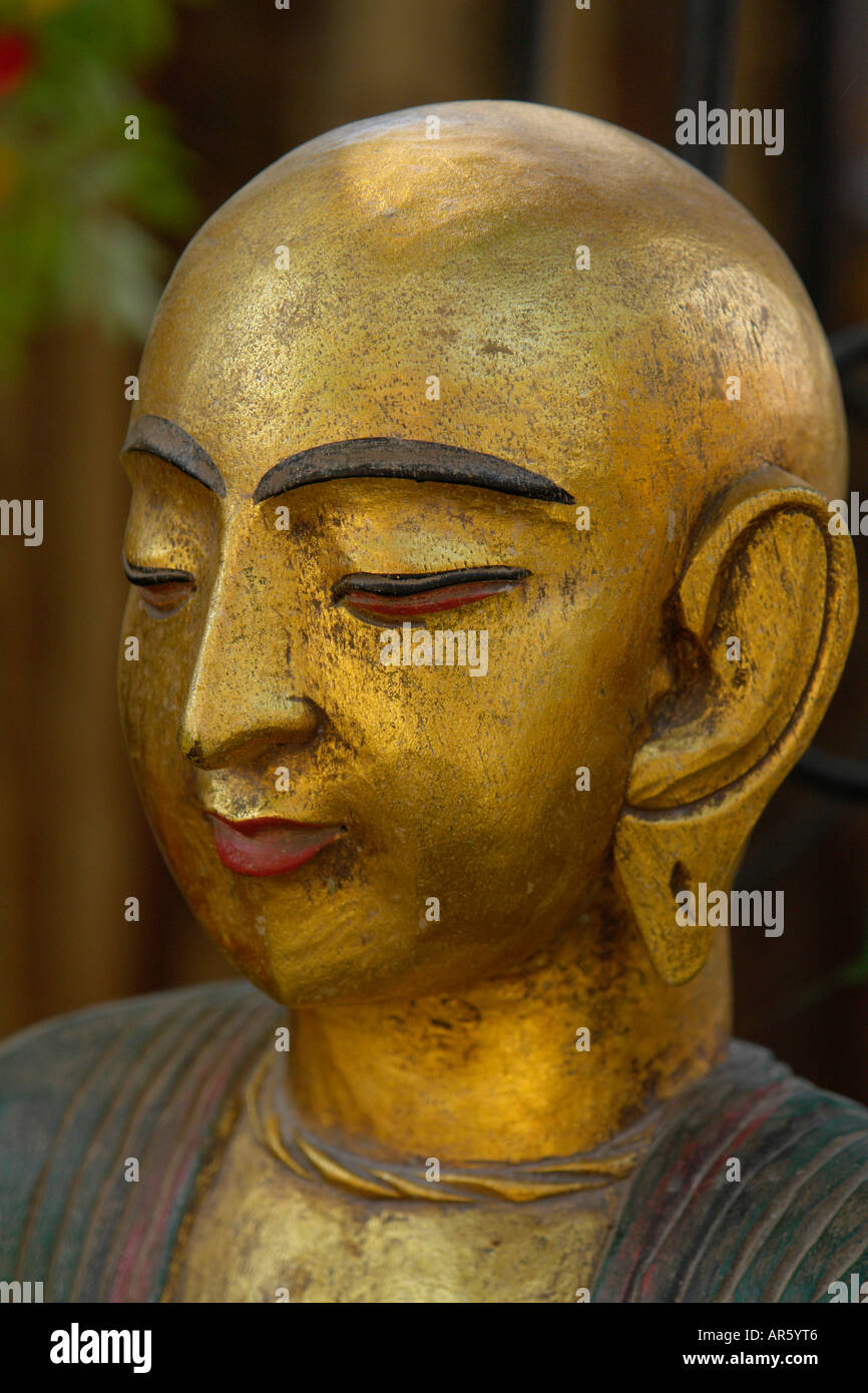 Golden statue of a holy monk Stock Photo - Alamy