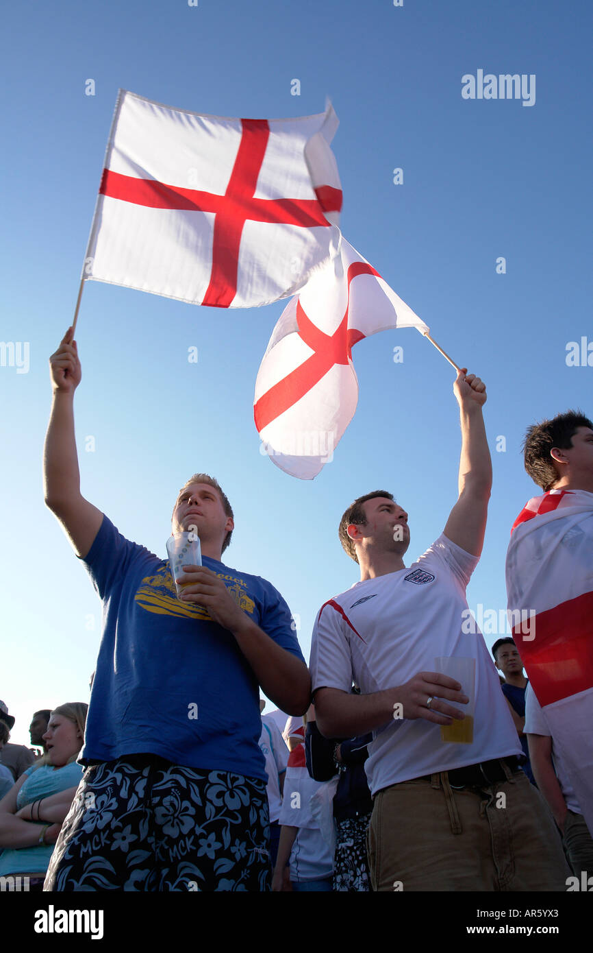 English Football fans waving flag to support their team at Olympia park ...