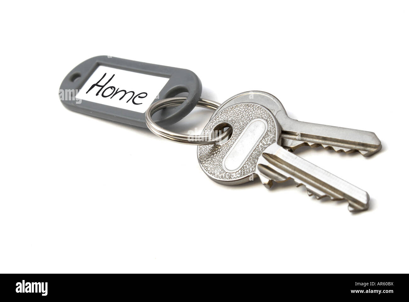 Key with home tag Isolated on white background Stock Photo - Alamy