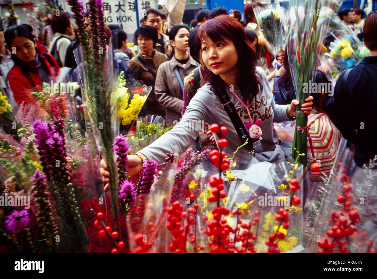 Buying flowers on Flower Market Street in Mong Kok, Hong Kong Stock ...