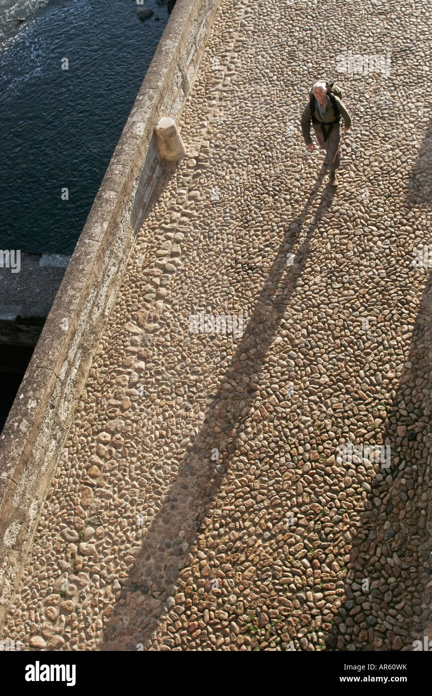 Long shadow from walking man from above Stock Photo - Alamy