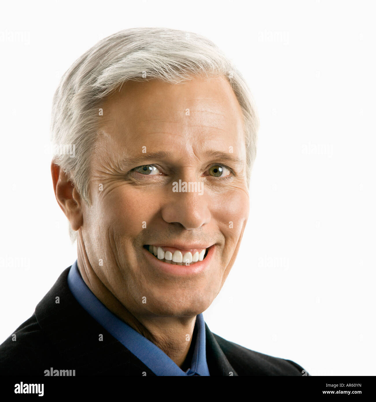 Middle aged Caucasian man in business suit smiling at viewer Stock ...