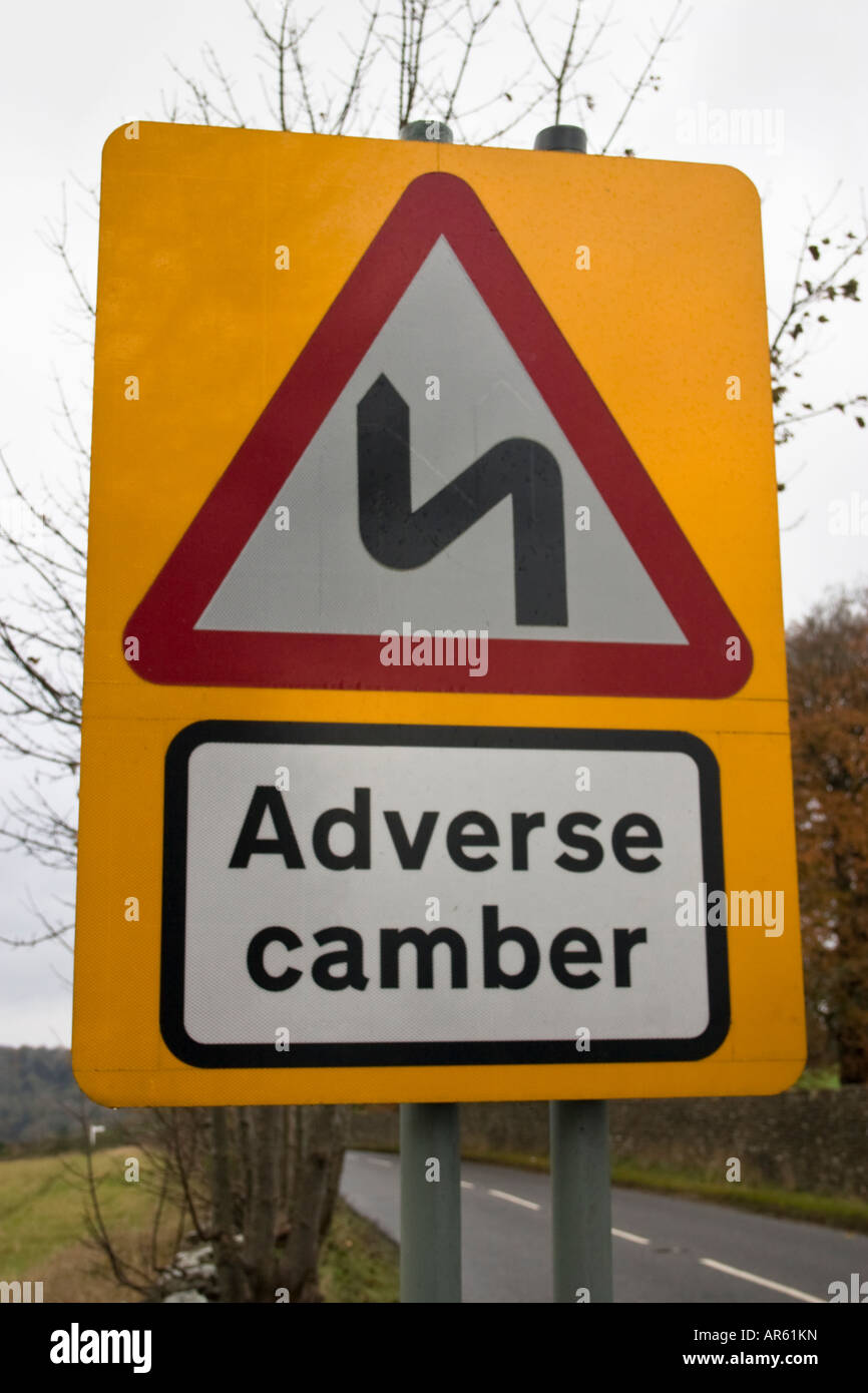 Caution adverse camber and road bends road sign Stock Photo - Alamy