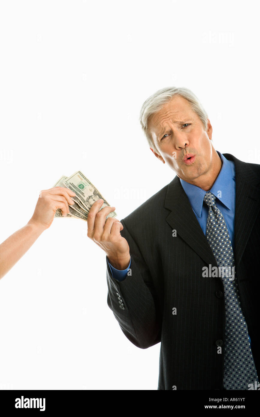 Woman holding money with Caucasian middle aged businessman making ...