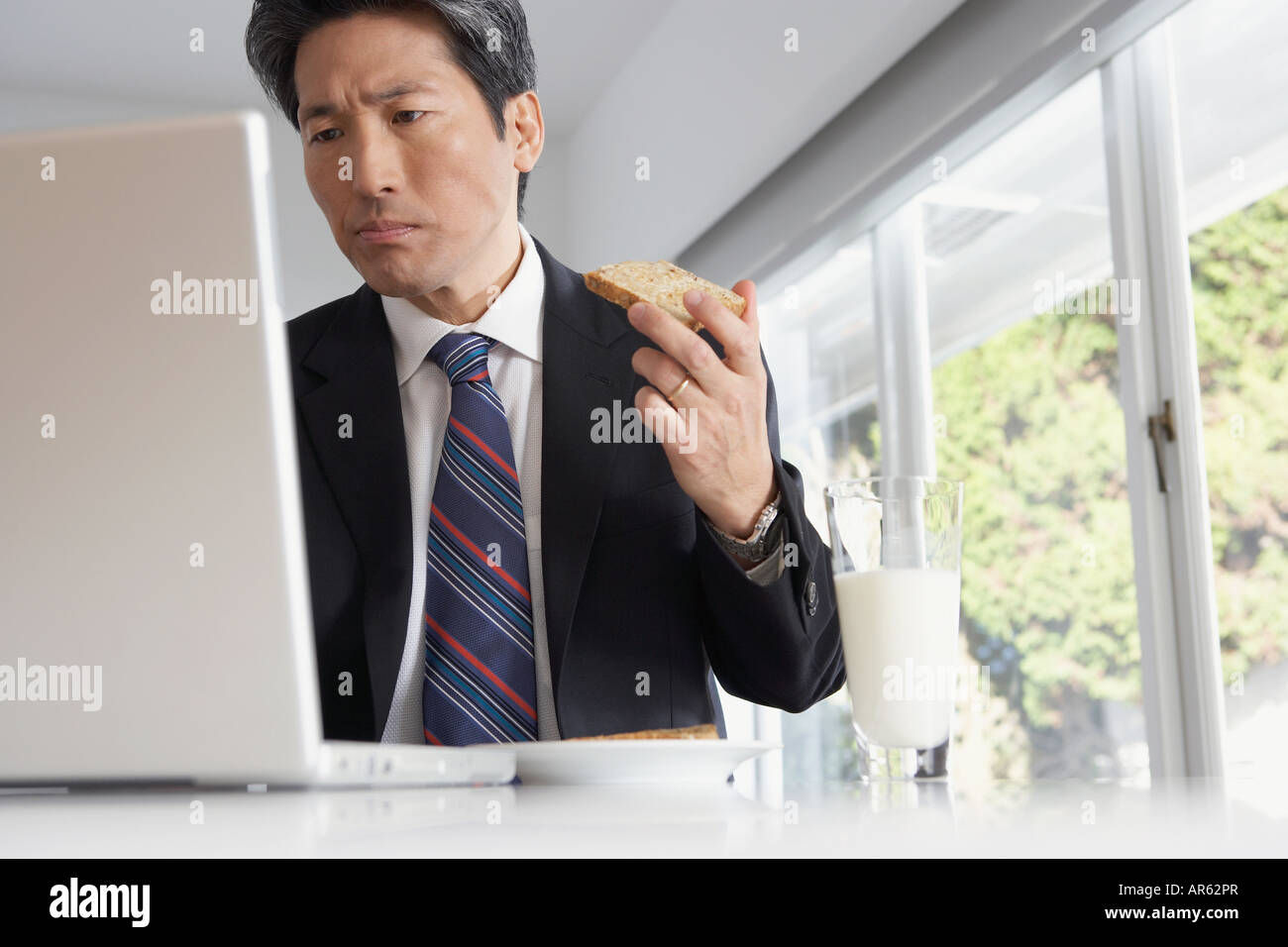 Businessman Eating Toast High Resolution Stock Photography and Images ...