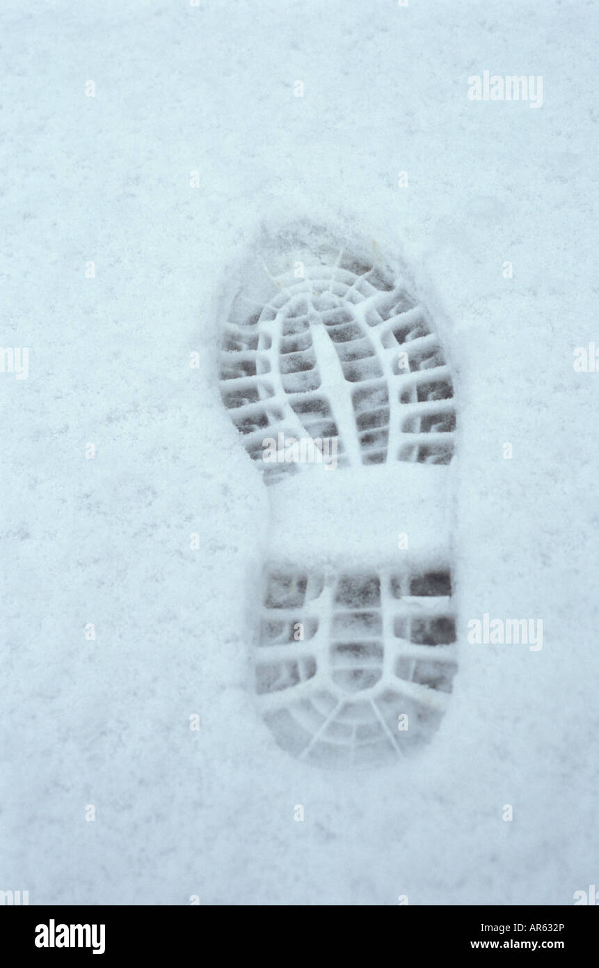 A footprint of a large boot in snow Stock Photo - Alamy