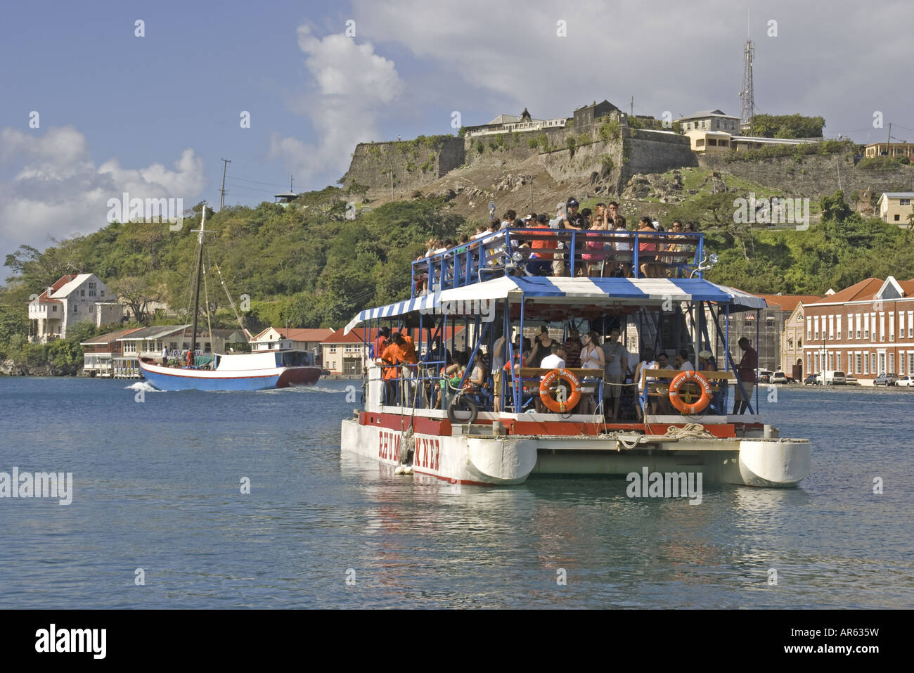 Harbor at Saint George's with Rhum Runner sightseeing boat and Fort ...