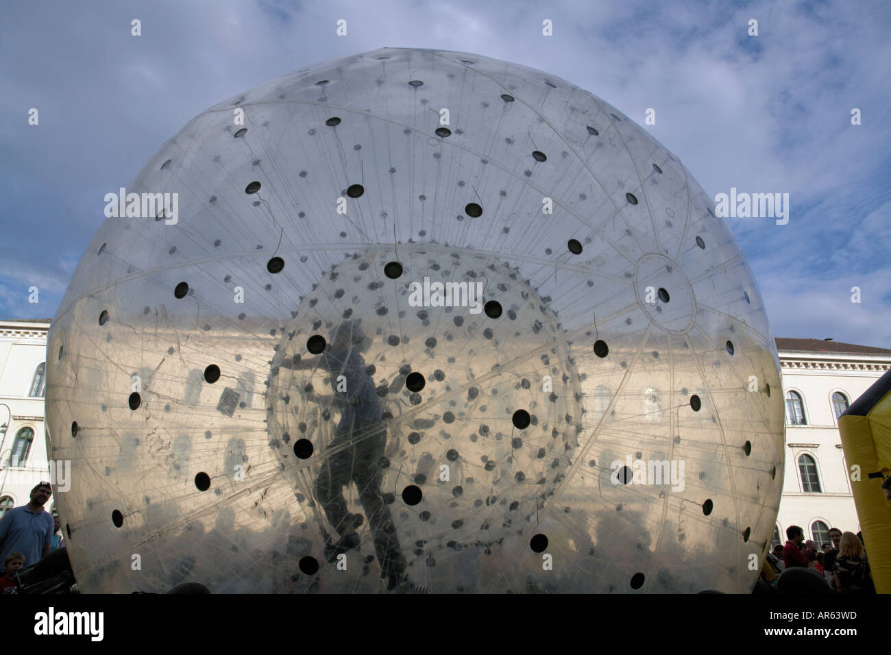 Child inside a giant transparent rolling ball Stock Photo - Alamy