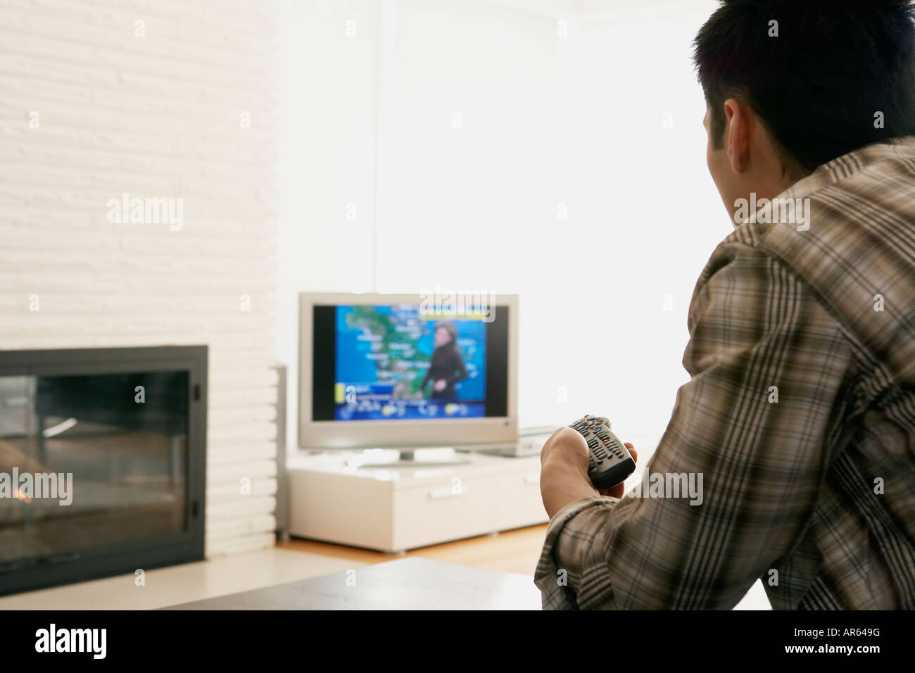 Person watching weather tv hi-res stock photography and images - Alamy