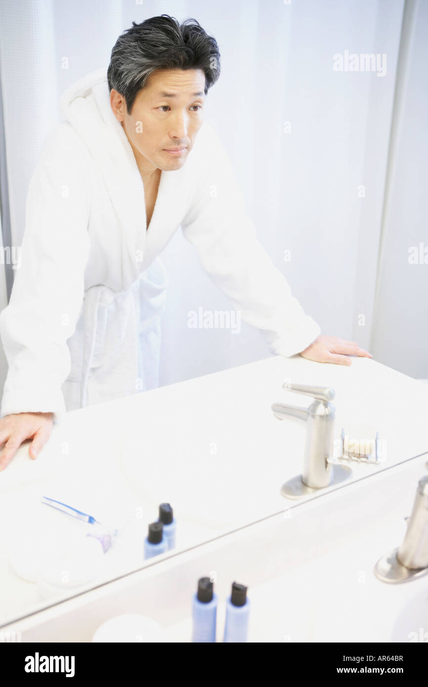 Man staring reflection in bathroom hi-res stock photography and images ...